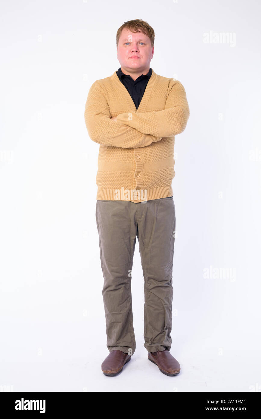 Full body shot of overweight man with arms crossed Stock Photo - Alamy