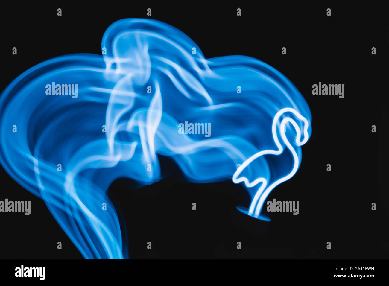 Neon blue flamingo LED lamp with wave in motion as blurred abstract ...