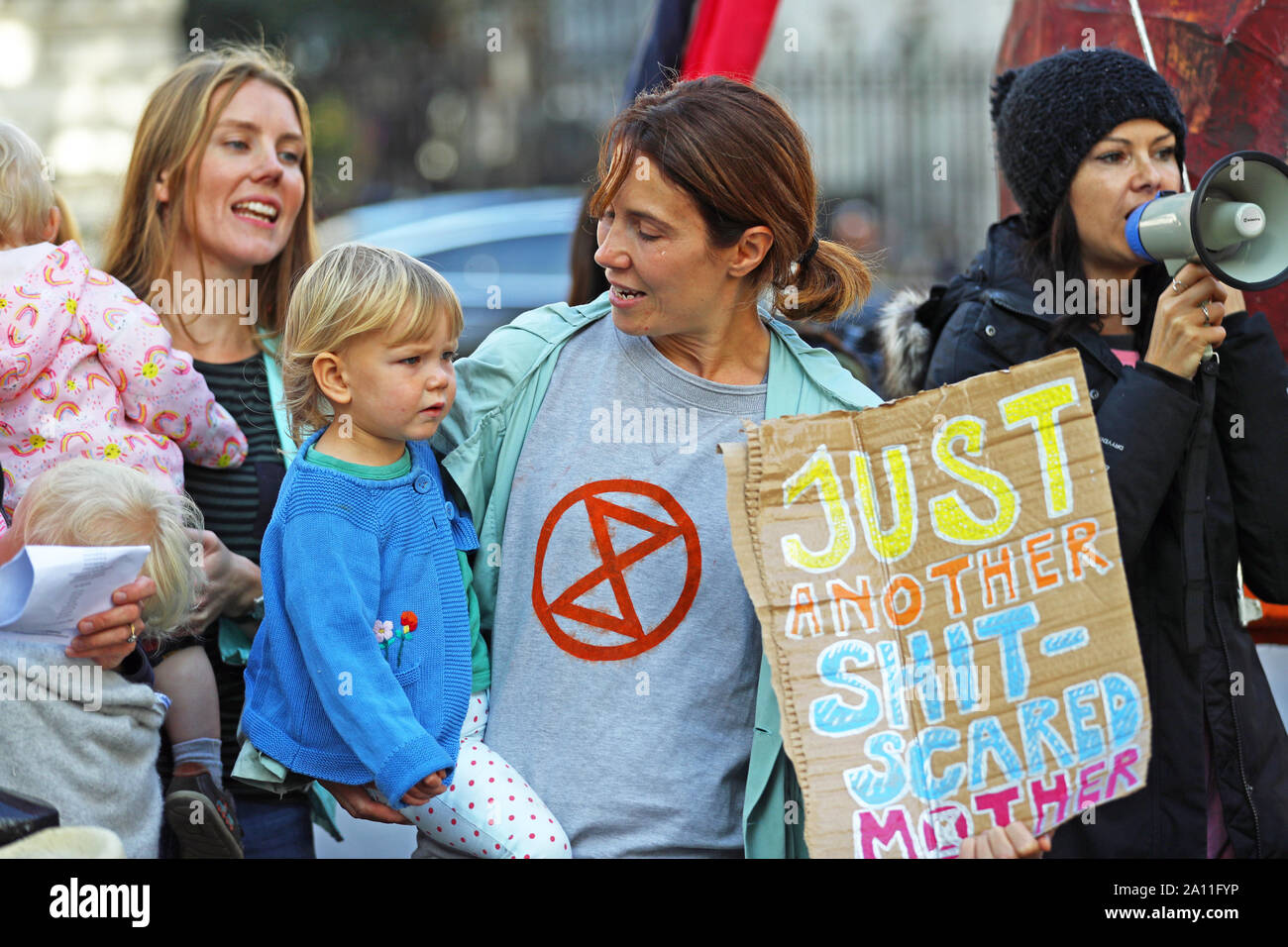 Mothers with their children in pushchairs at a protest organised by ...