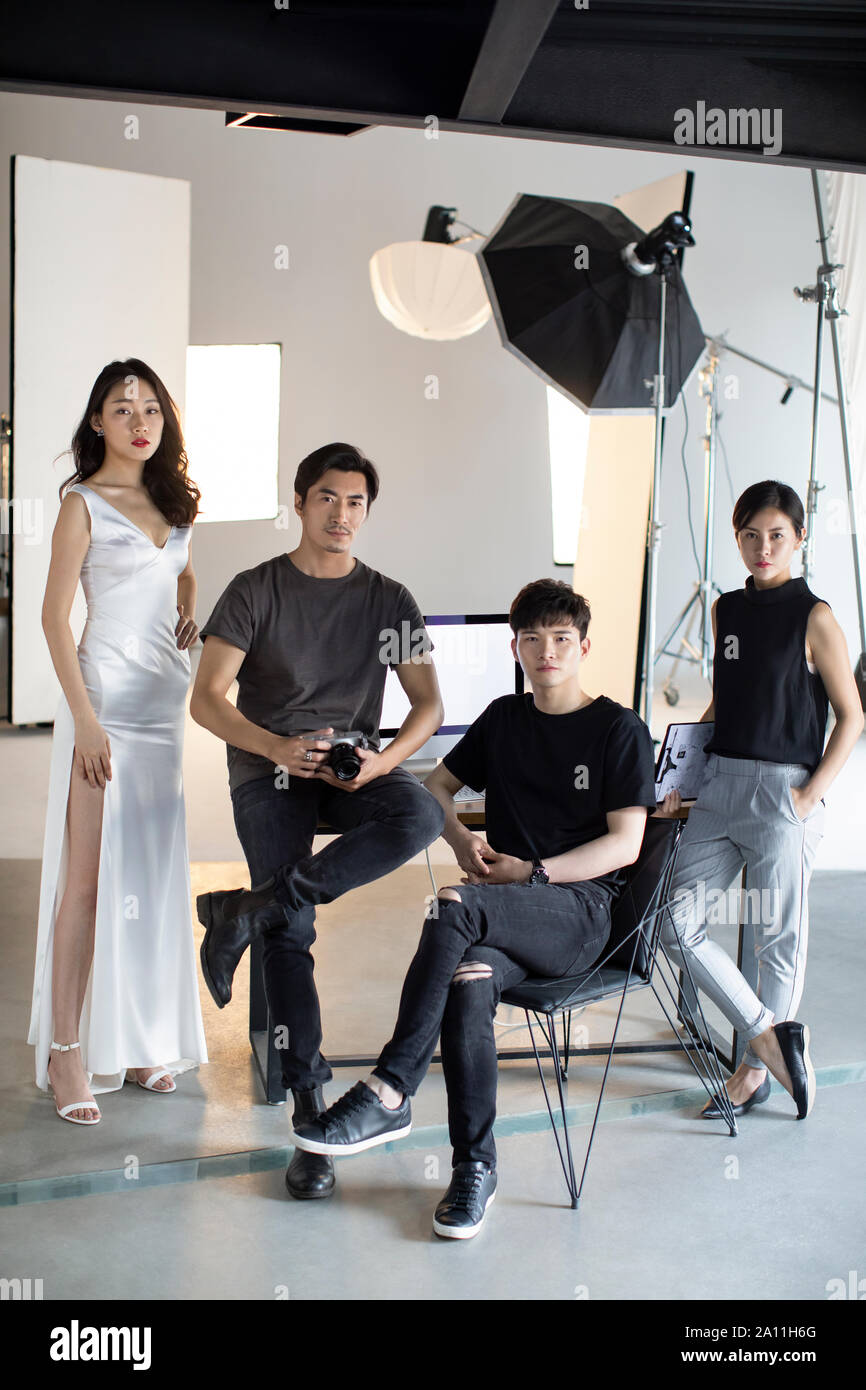 Photographers and model in studio Stock Photo - Alamy