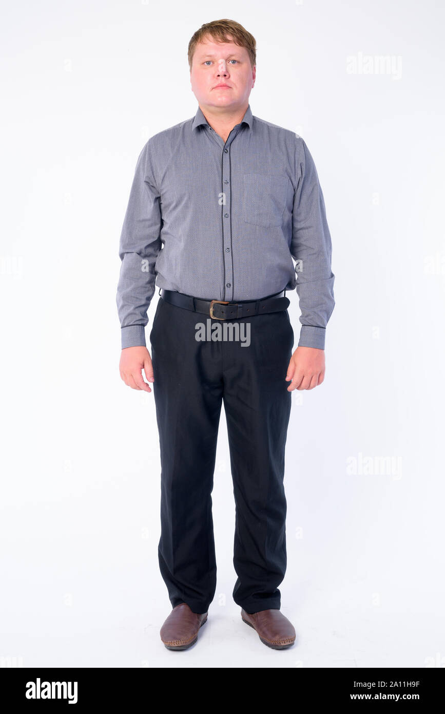 Full body shot of overweight businessman looking at camera Stock Photo ...