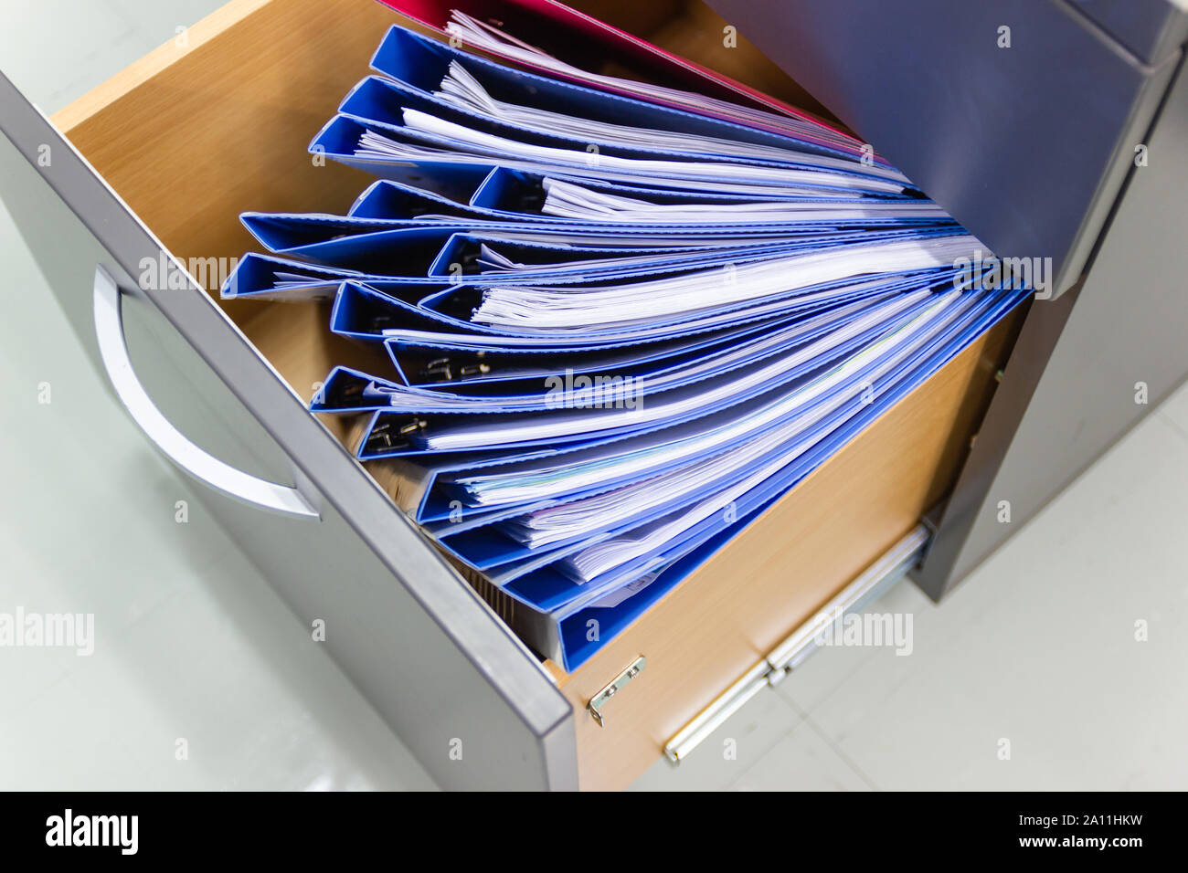 blue file folder documents In a file cabinet retention of contracts ...
