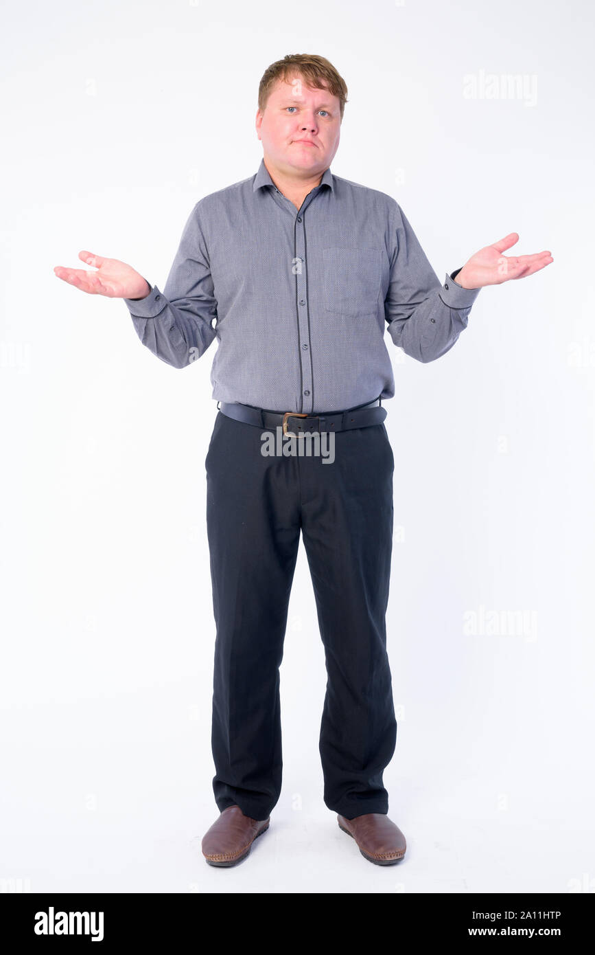 Blonde casual businessman shrugging shoulders hi-res stock photography ...