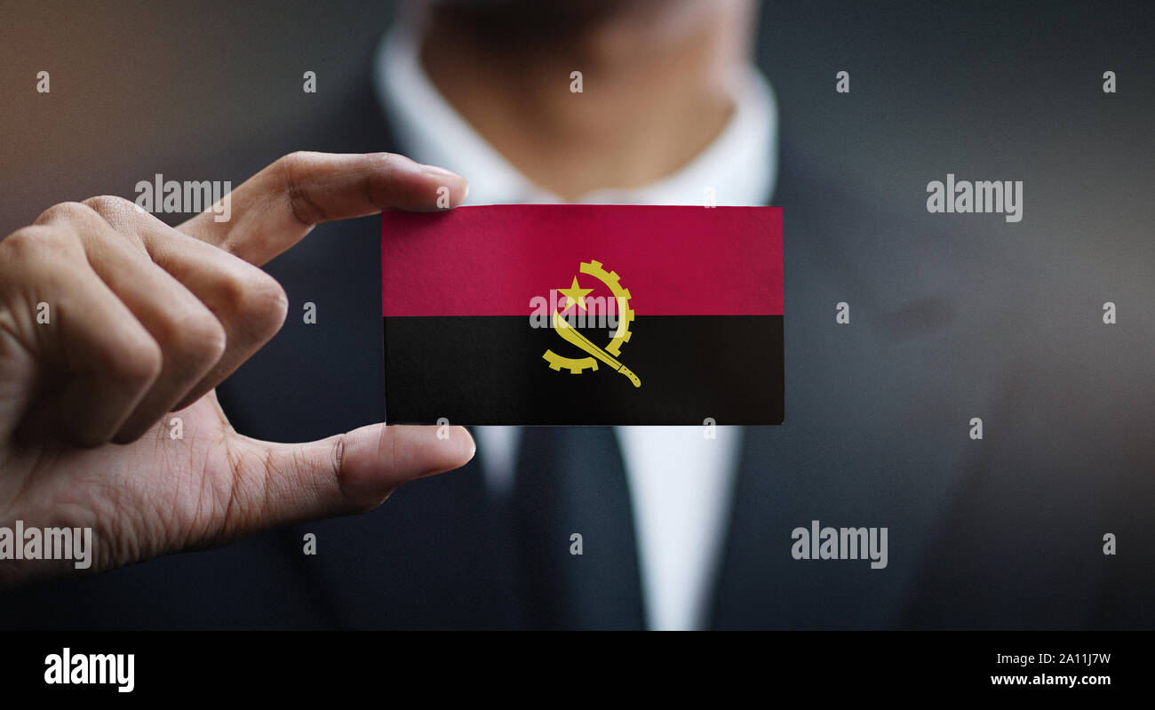 Businessman Holding Card of Angola Flag Stock Photo - Alamy