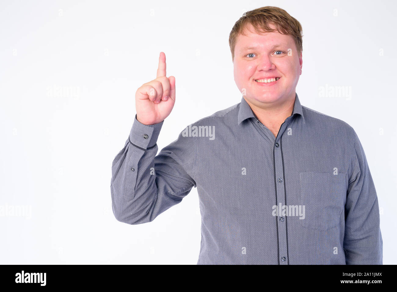 Happy blonde businessman pointing up hi-res stock photography and ...