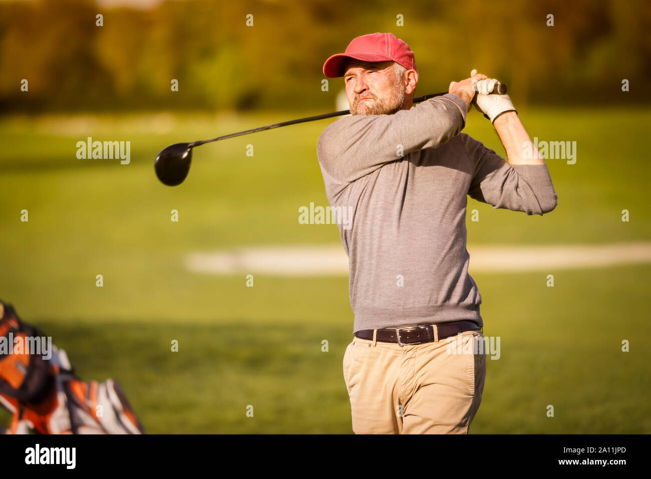 Person teeing off hi-res stock photography and images - Alamy