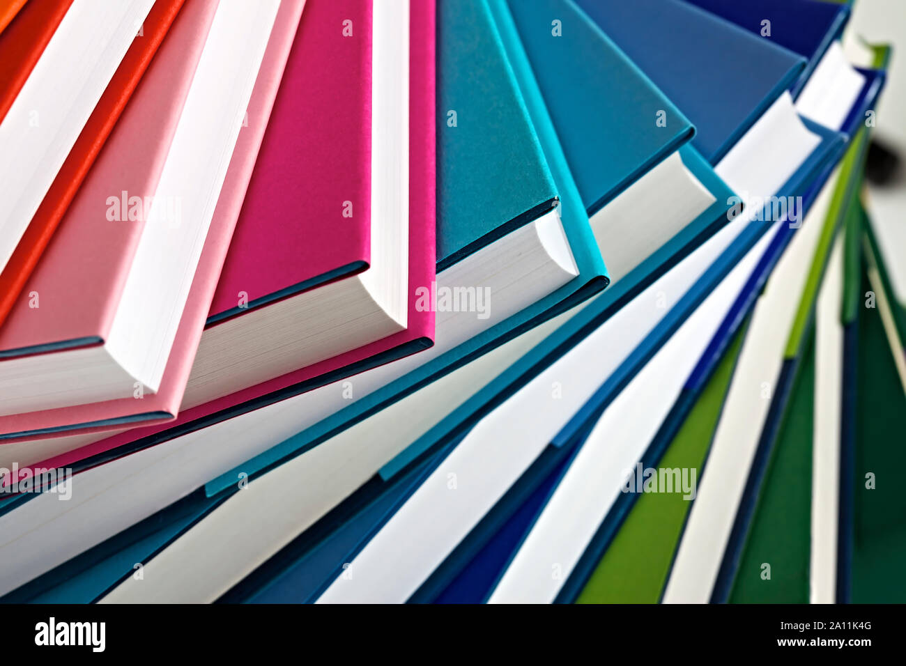 Close-up of spiral stack of books Stock Photo - Alamy