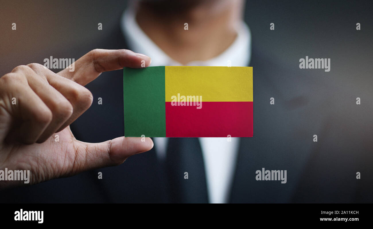 Businessman Holding Card of Benin Flag Stock Photo - Alamy