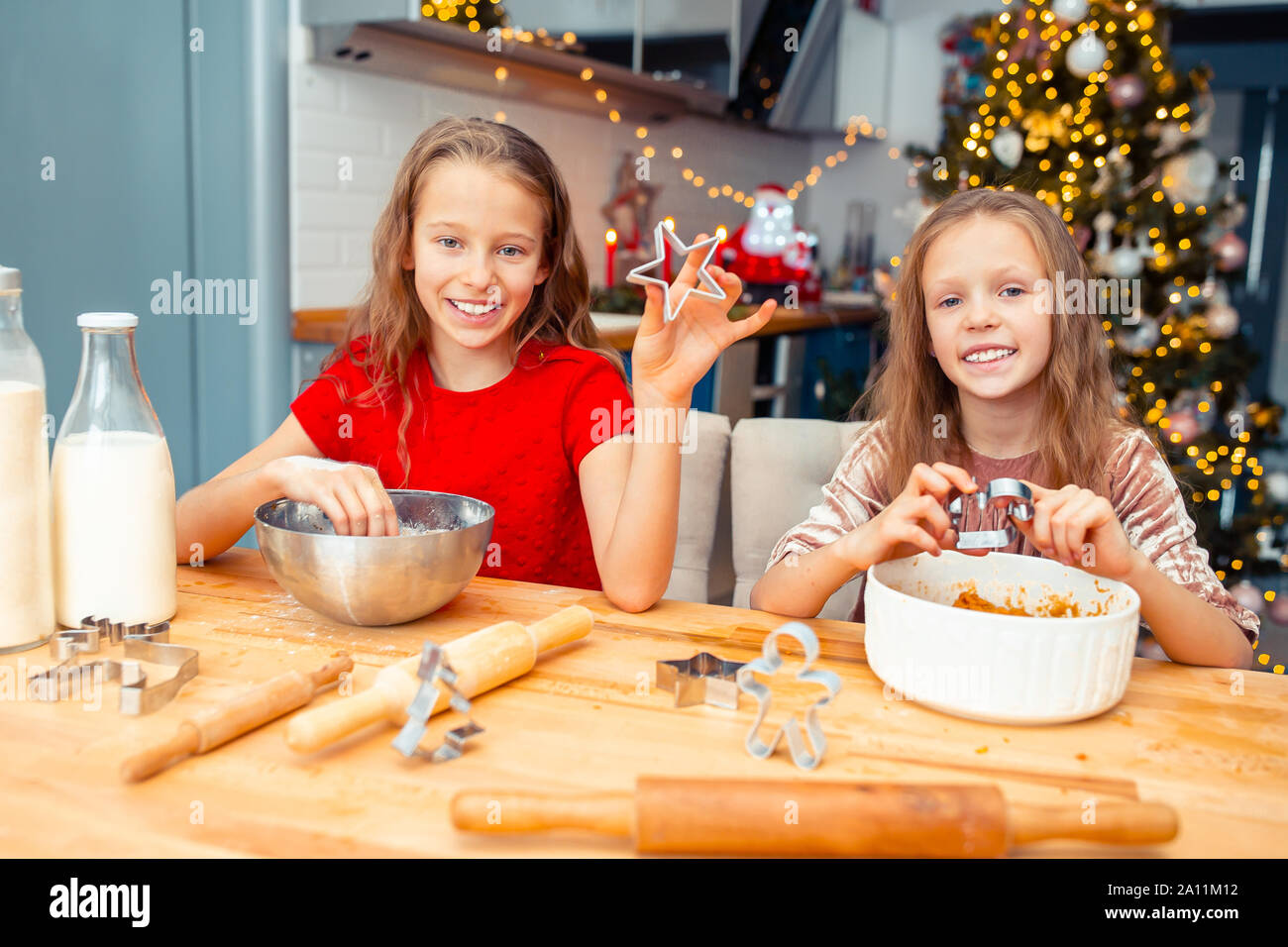 Kids baking ginger cookies on Christmas. Happy kids celebrating holiday ...