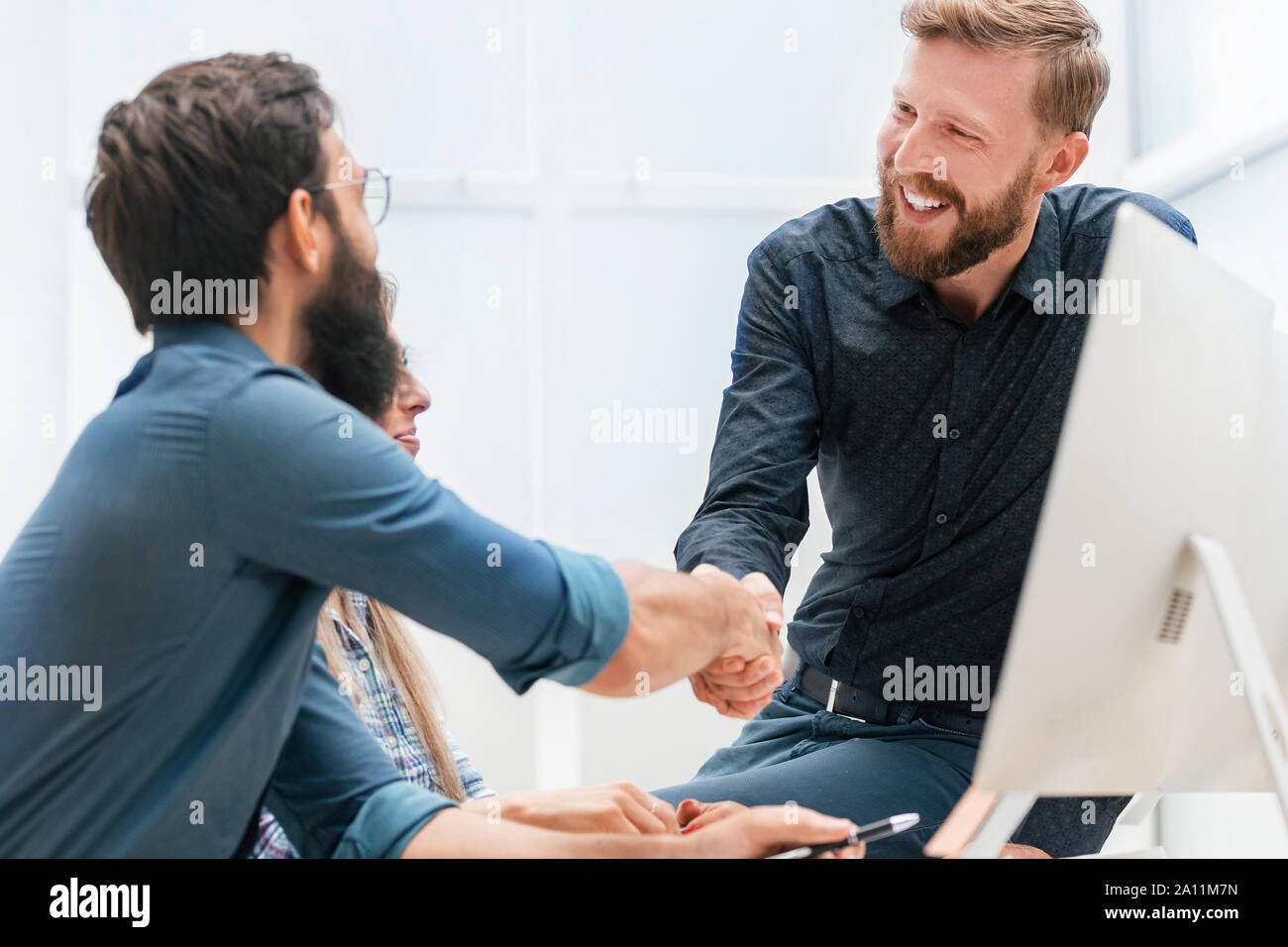 Employees shaking hands hi-res stock photography and images - Alamy