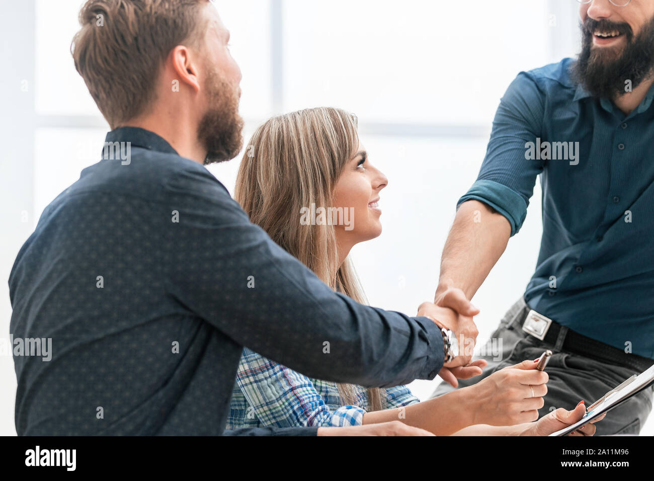 Handshake employees in office hi-res stock photography and images - Alamy