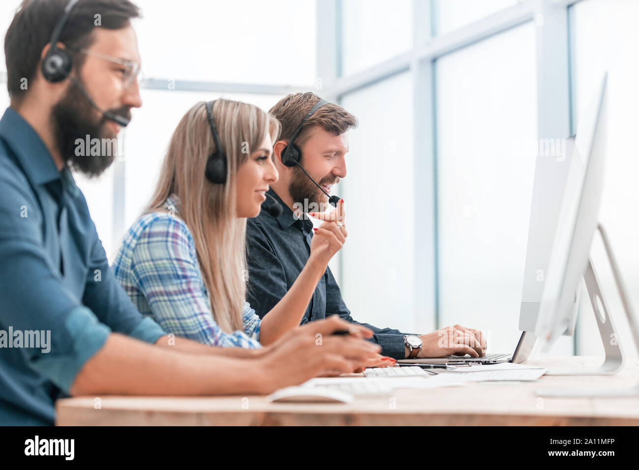 Business colleagues computers headset hi-res stock photography and ...