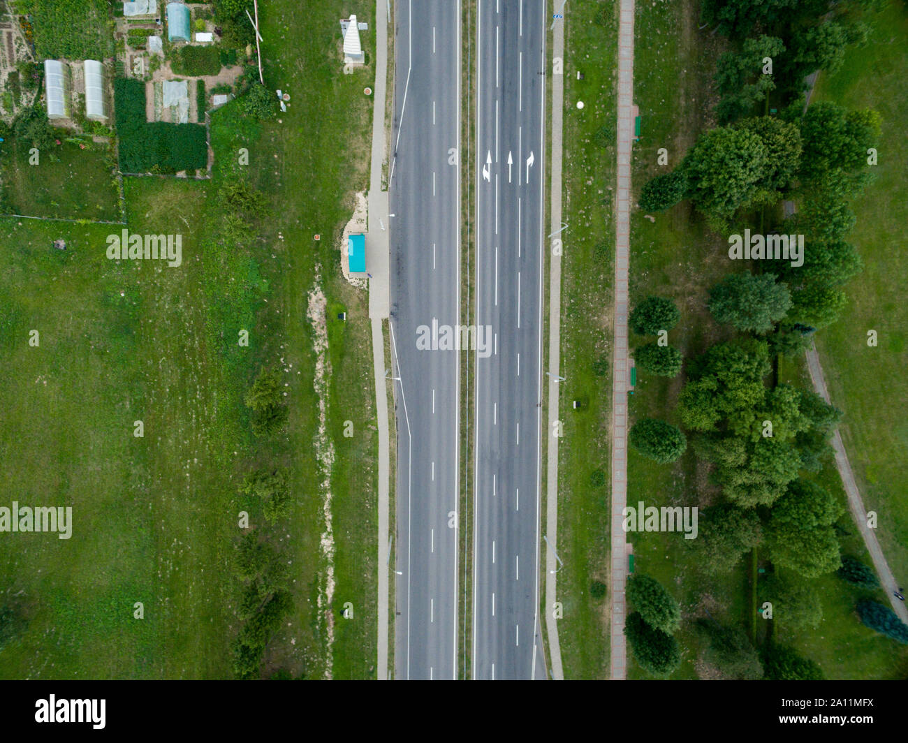 Top view asphalt road, highway, a crossroads in the village on a bright ...