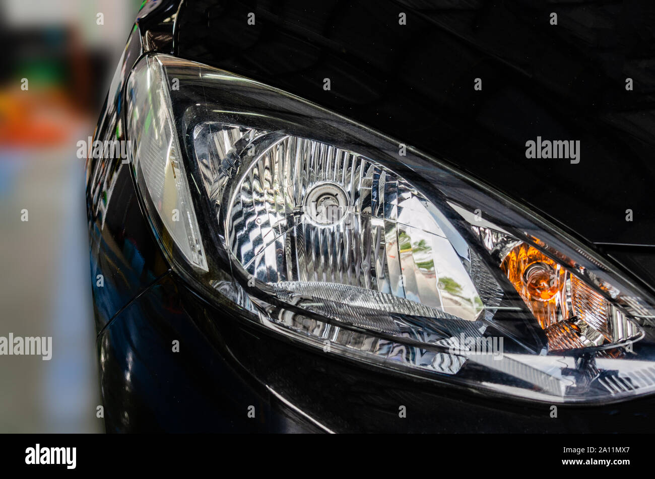 Modern polished car front lamp to give a shine Stock Photo - Alamy