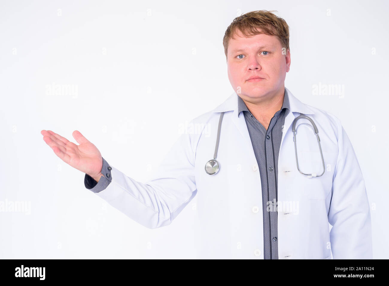 Portrait of overweight man doctor showing something Stock Photo - Alamy