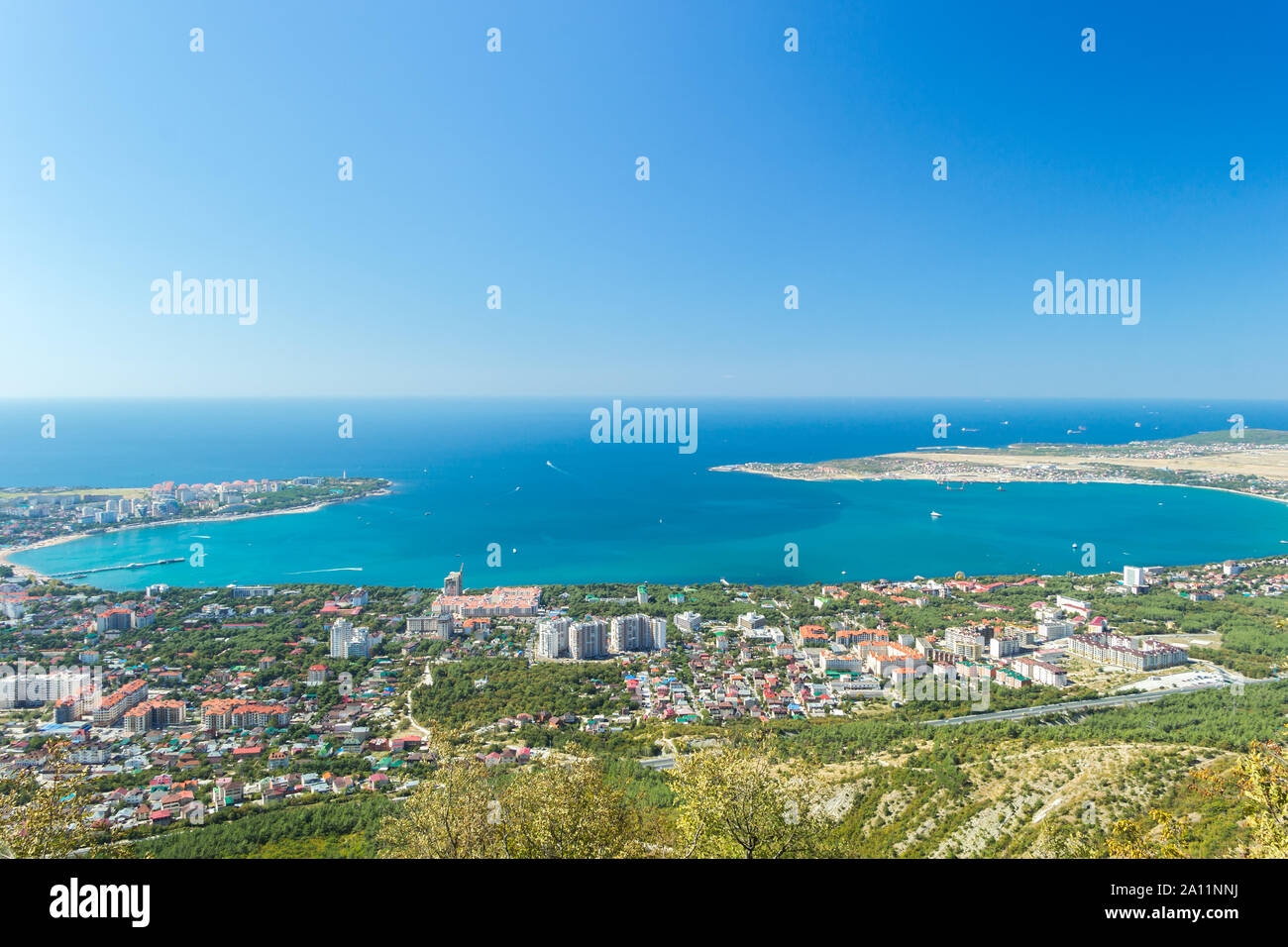 Aerial view of Gelendzhik sea bay. Buildings, beaches, ships in blue ...