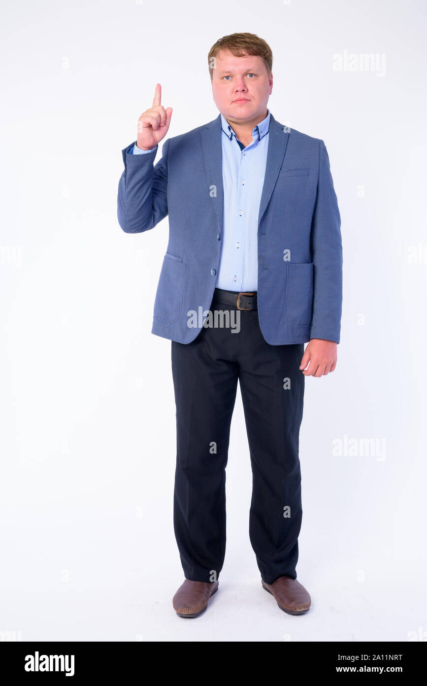 Full body shot of overweight businessman in suit pointing up Stock ...