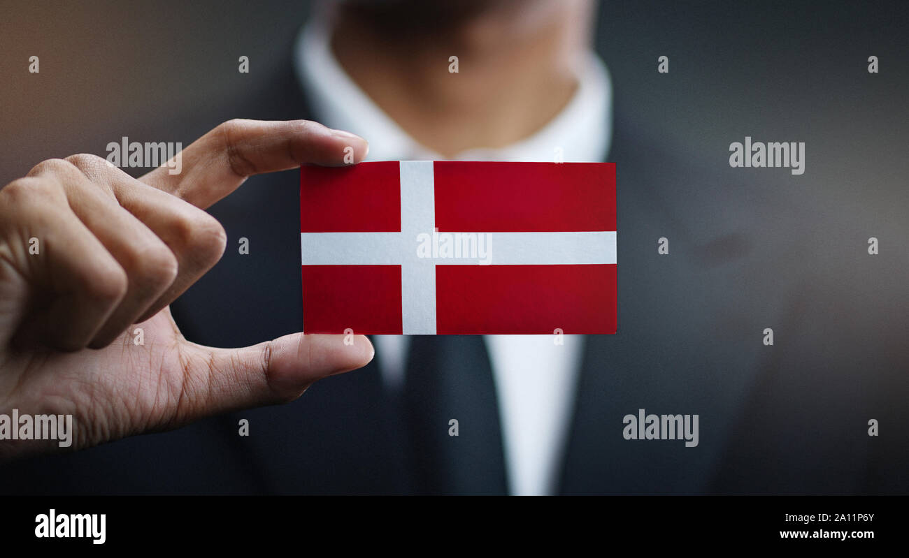Businessman Holding Card of Denmark Flag Stock Photo - Alamy