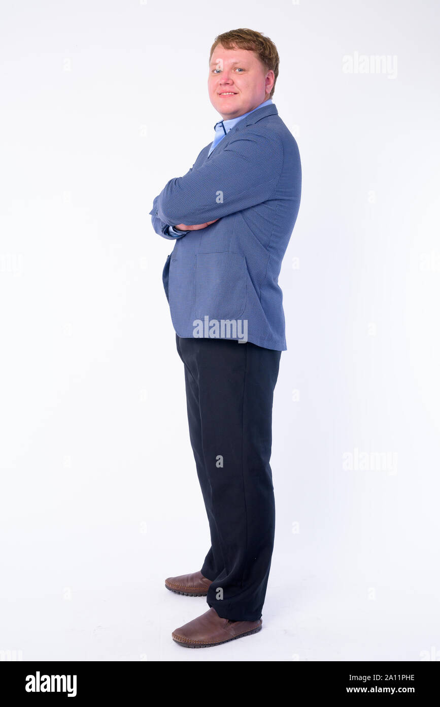 Full body shot profile view of happy overweight businessman looking at ...