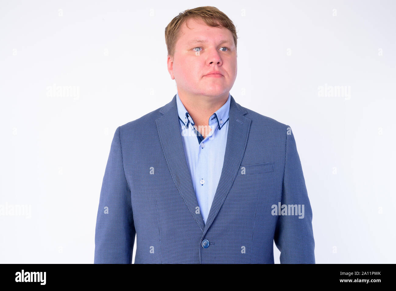 Portrait of overweight businessman in suit thinking Stock Photo - Alamy