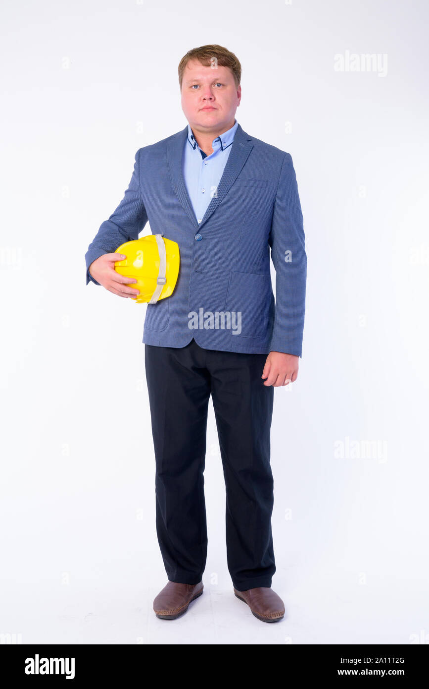 Full body shot of overweight businessman as engineer Stock Photo - Alamy