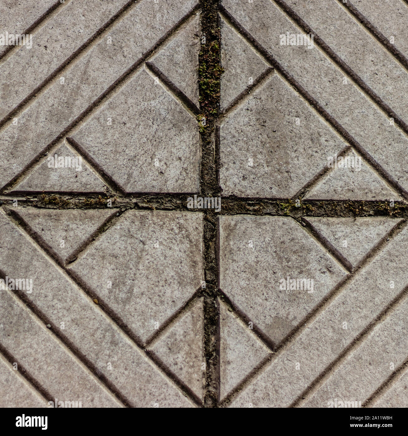 an old square shape from a pavement - straight lines at corners. a ...