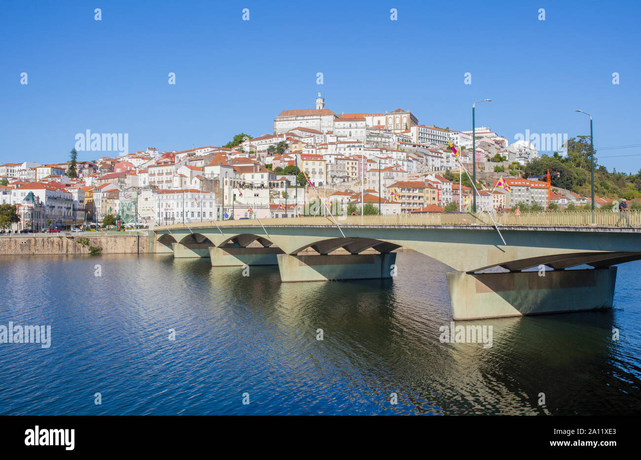 View of Santa Clara Bridge over the Mondego River with the old town on ...