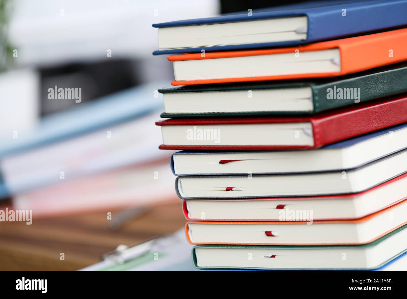 Lot of book li on the table against study room background Stock Photo ...