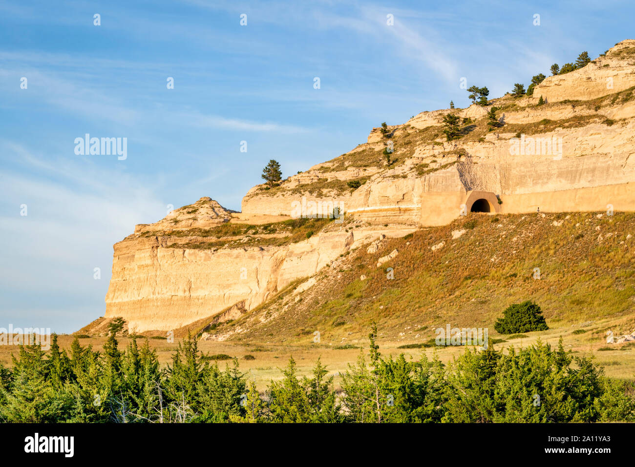 Scotts Bluff National Monument with summit road as seen in sunset light ...