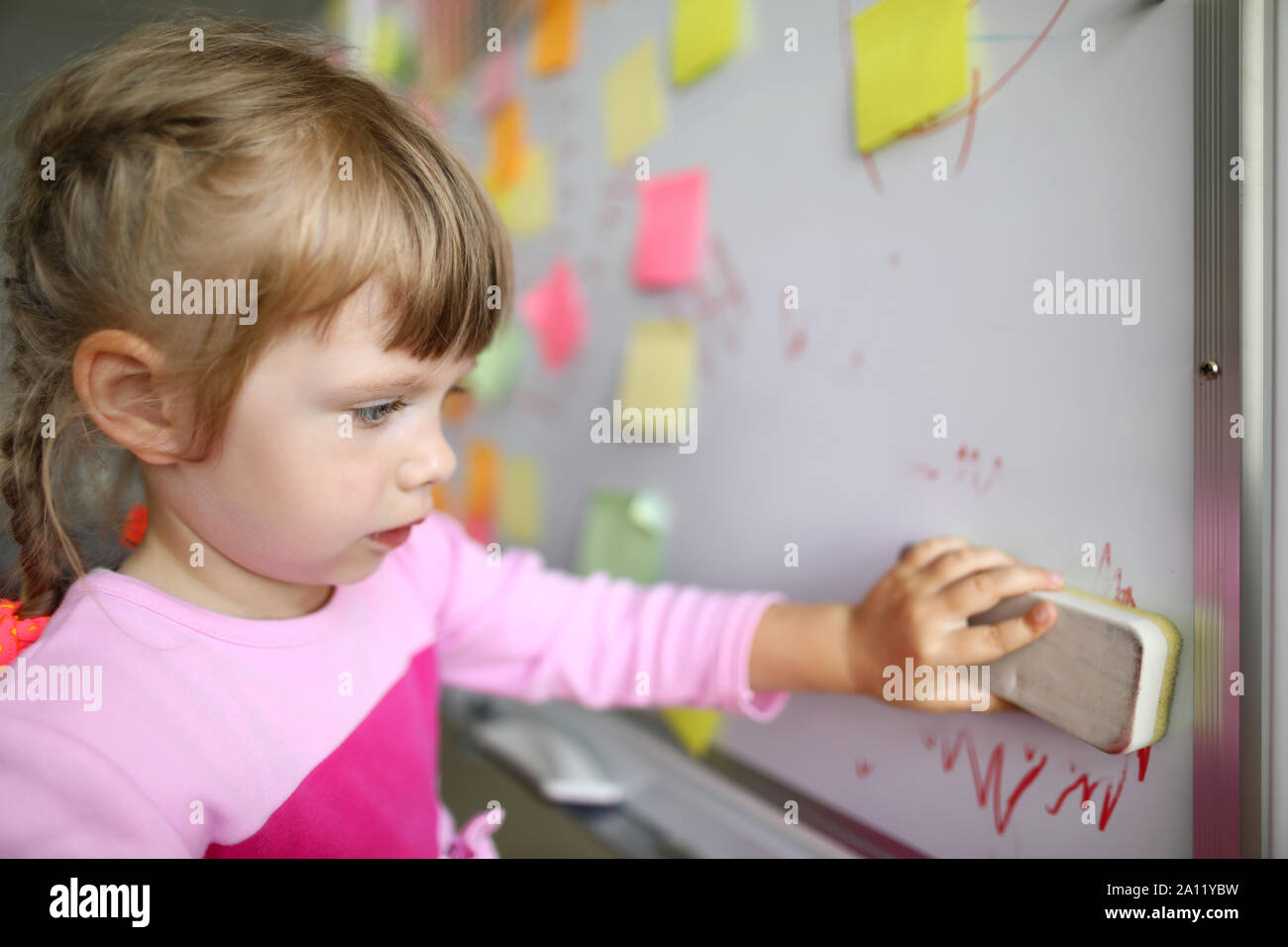 Attentive little kid Stock Photo - Alamy