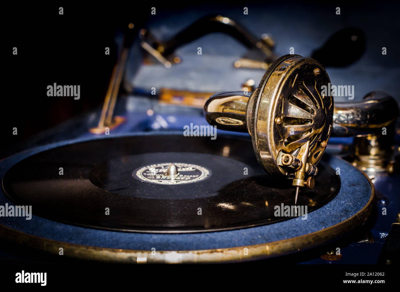 old blue gramophone with vinyl record Stock Photo - Alamy