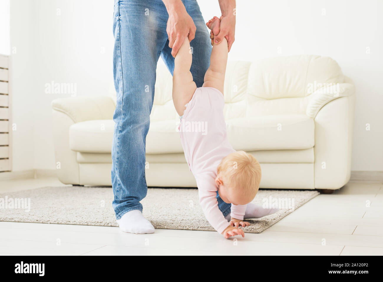 family, parenthood and fatherhood concept - happy father playing with ...