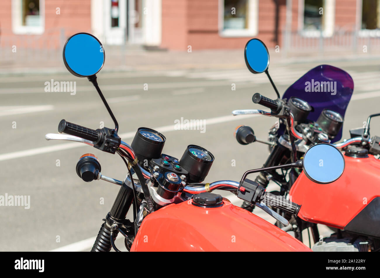 two red vintage motorcycle cafe racer on a city street close up Stock ...