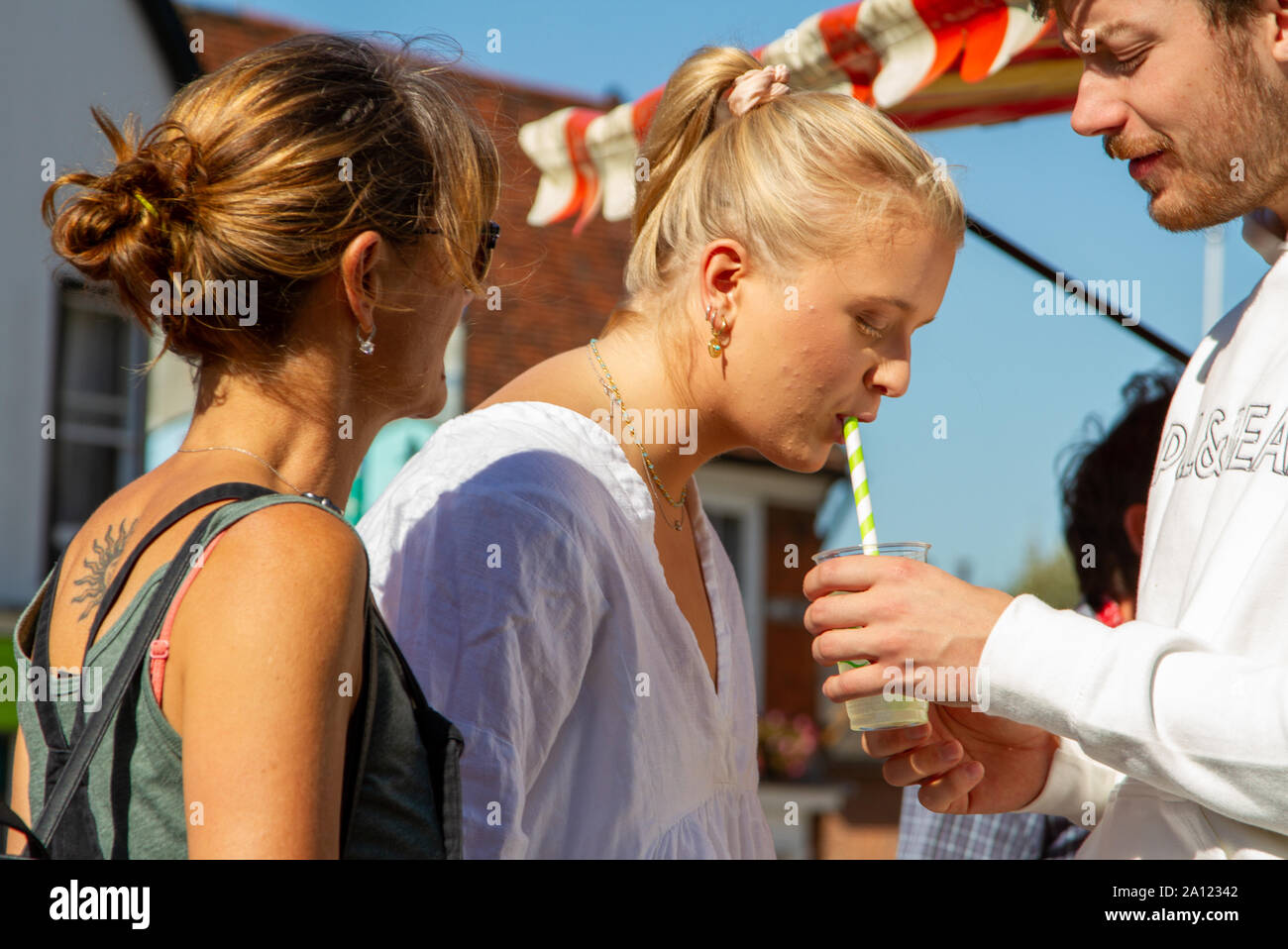 Drinking soft drink through a straw hi-res stock photography and images - Alamy