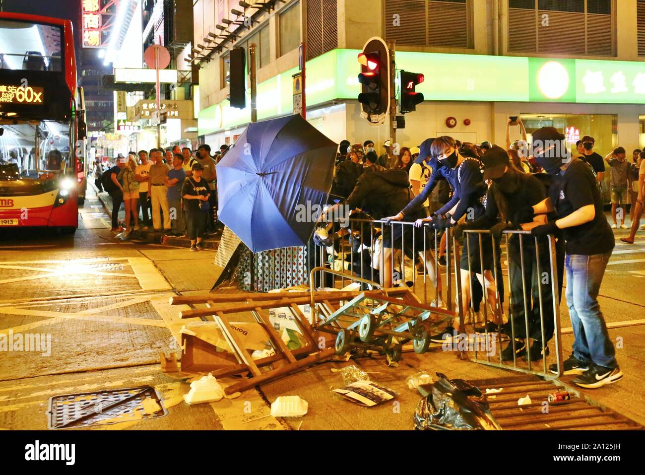 Hong Kong, China. 22nd Sep, 2019. Protesters set up the barricades and ...