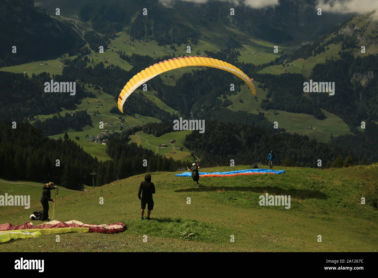 Paragliding in Engleberg, Switzerland, The Alps Stock Photo - Alamy