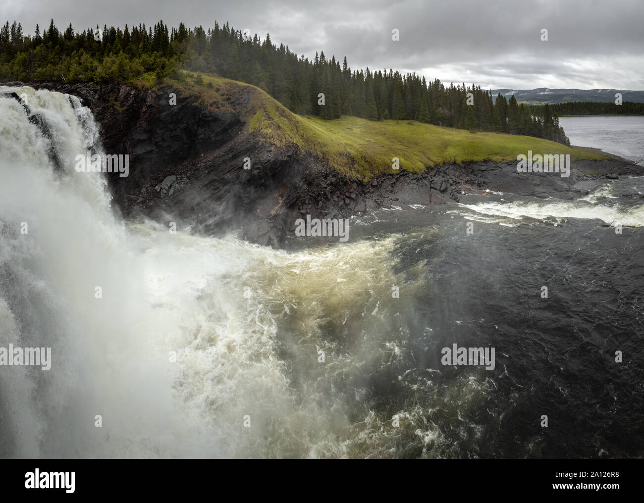 The biggest waterfall of Sweden. High water level of the river after ...