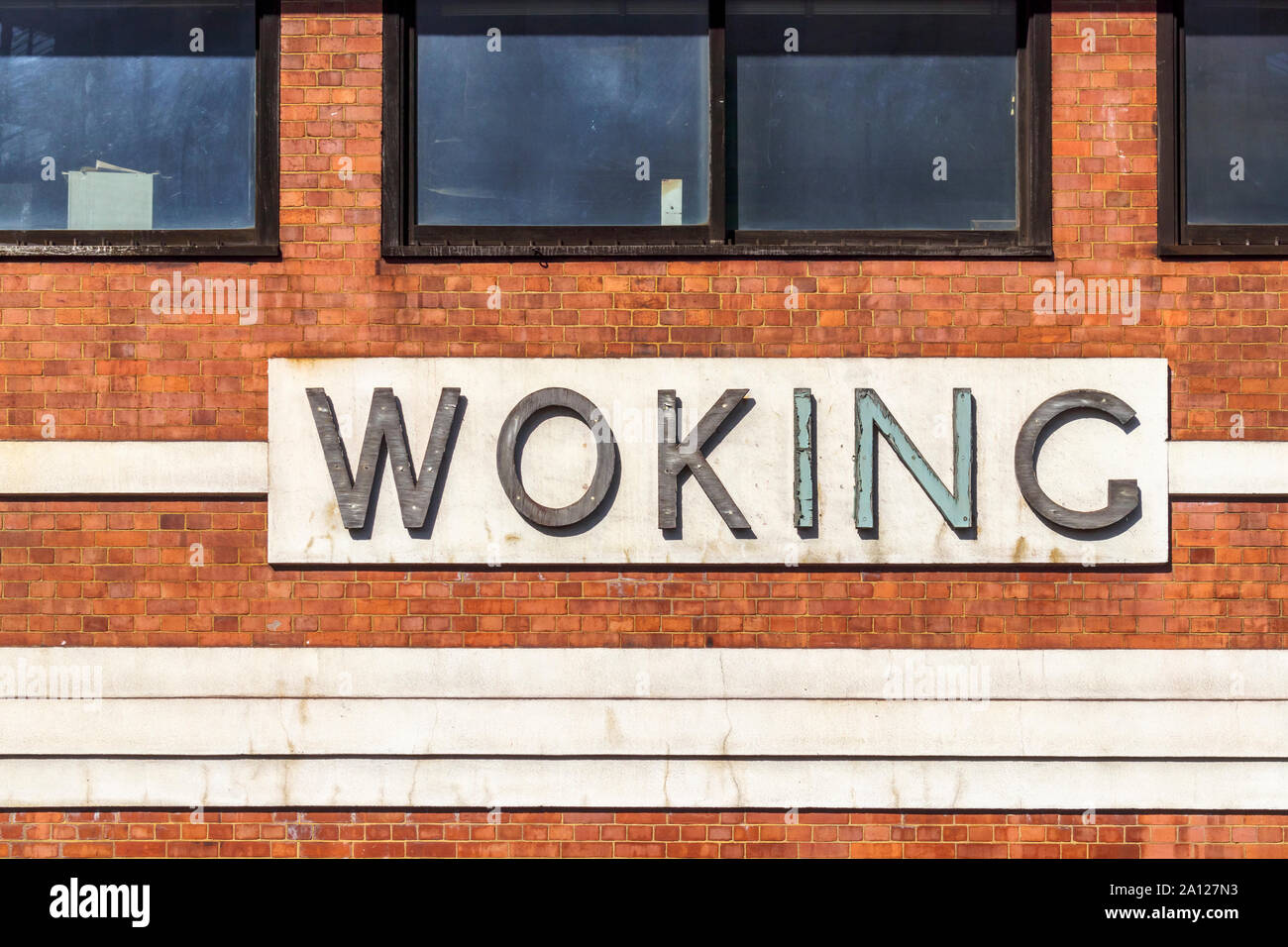 The old-fashioned red brick built signal box in the station at Woking ...
