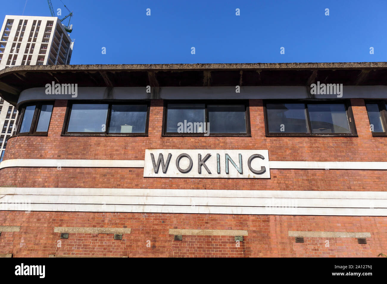 The old-fashioned red brick built signal box in the station at Woking ...