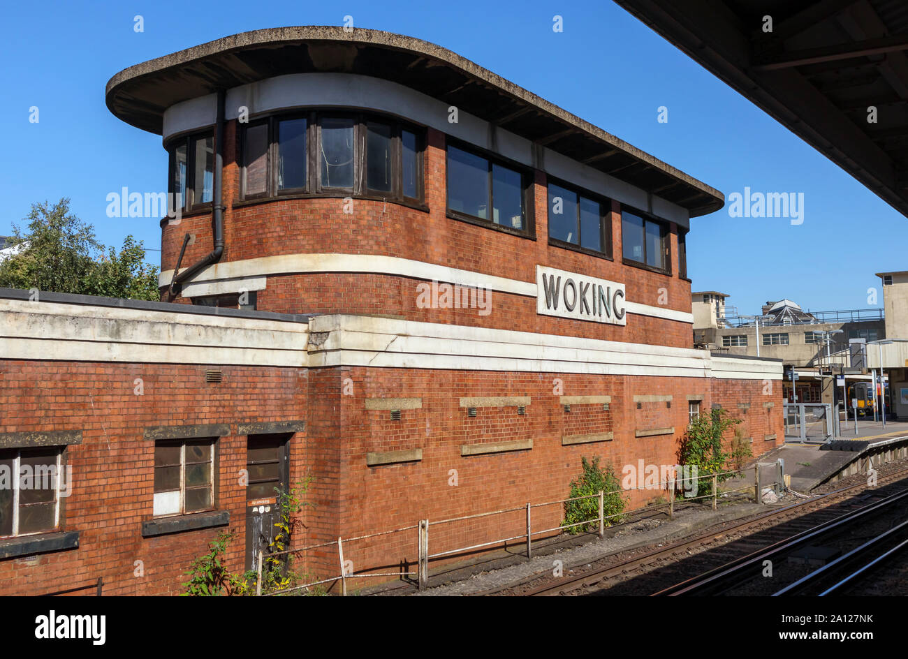 The old-fashioned red brick built signal box in the station at Woking ...