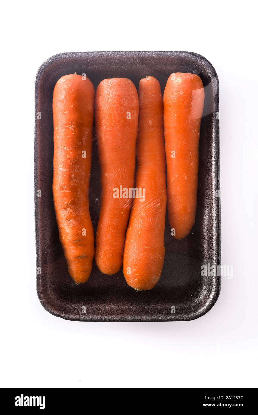 Carrots packaged in plastic isolated on white background. Top view ...