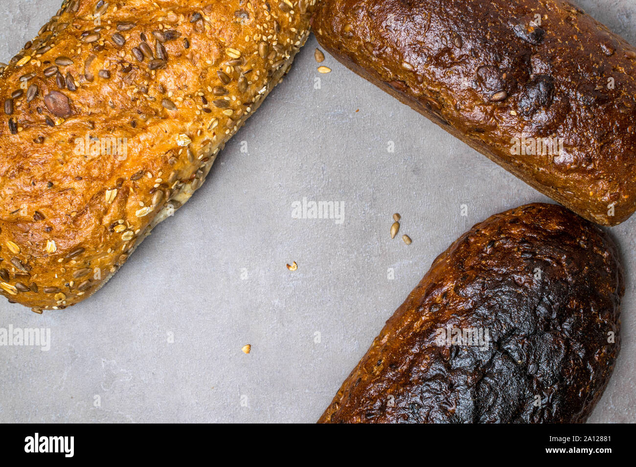 different bread loaf on grey background, mix fresh bread Stock Photo ...