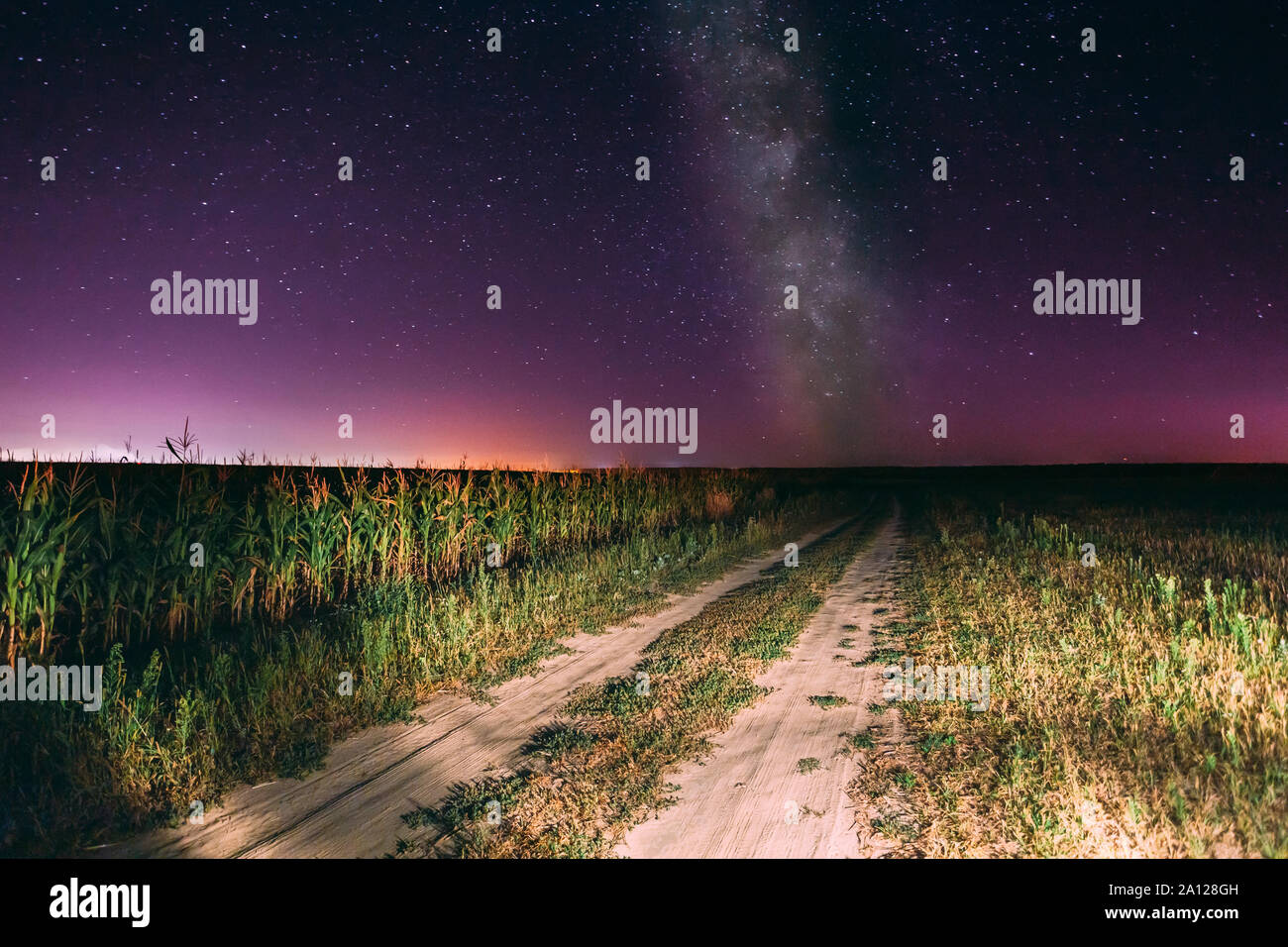 Night Starry Sky With Milky Way Glowing Stars And Country Road In ...