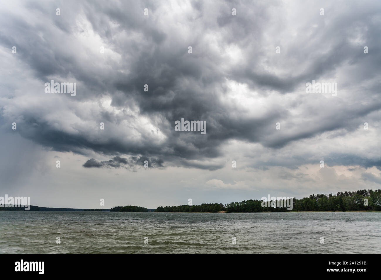 Heavy storm clouds over the lake Stock Photo - Alamy
