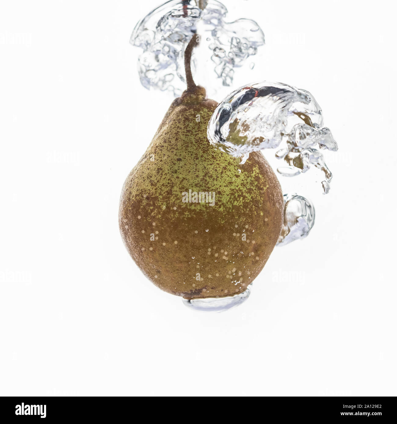 Beautiful fresh pear in water bubble white background Stock Photo - Alamy