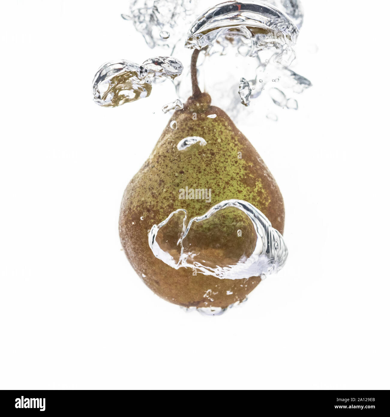 Beautiful fresh pear in water bubble white background Stock Photo - Alamy