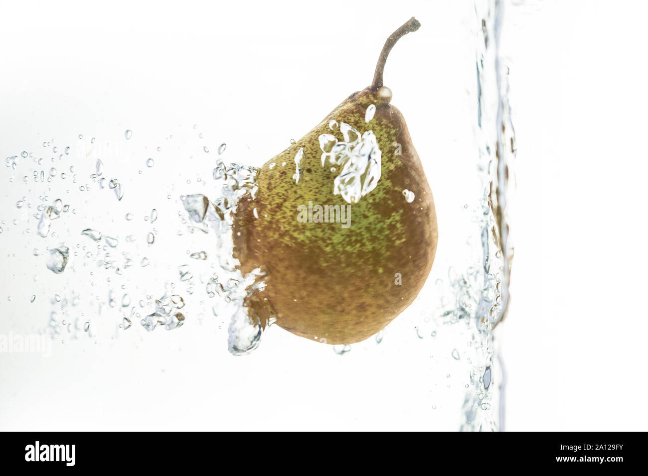 Beautiful fresh pear in water bubble white background Stock Photo - Alamy