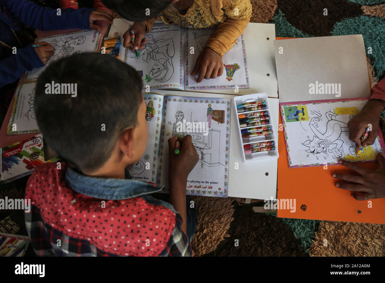 22 September 2019, Syria, Hazano: Syrian children study inside a bus ...
