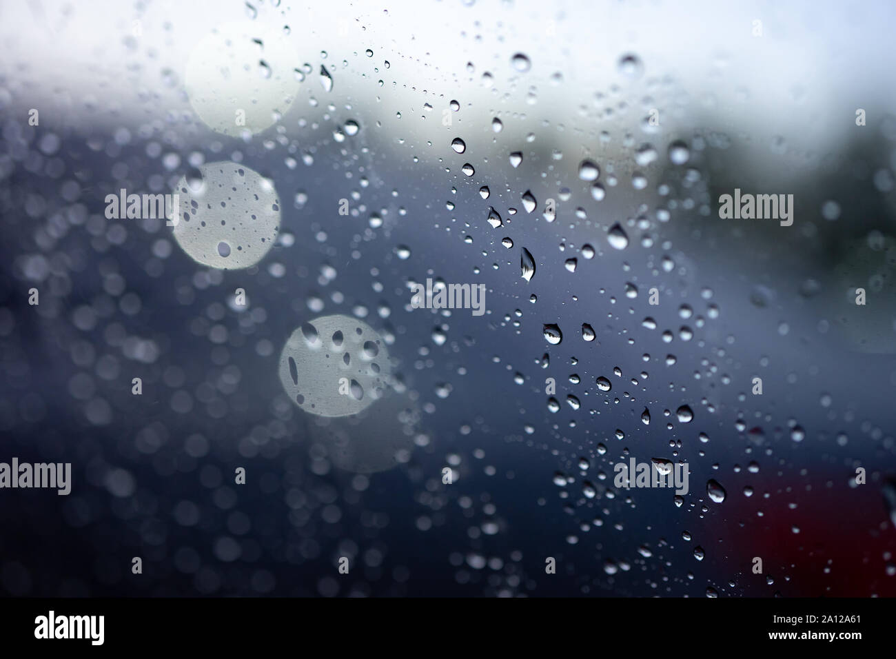 Abstract blurred Rain while the car is in the middle of the road at ...