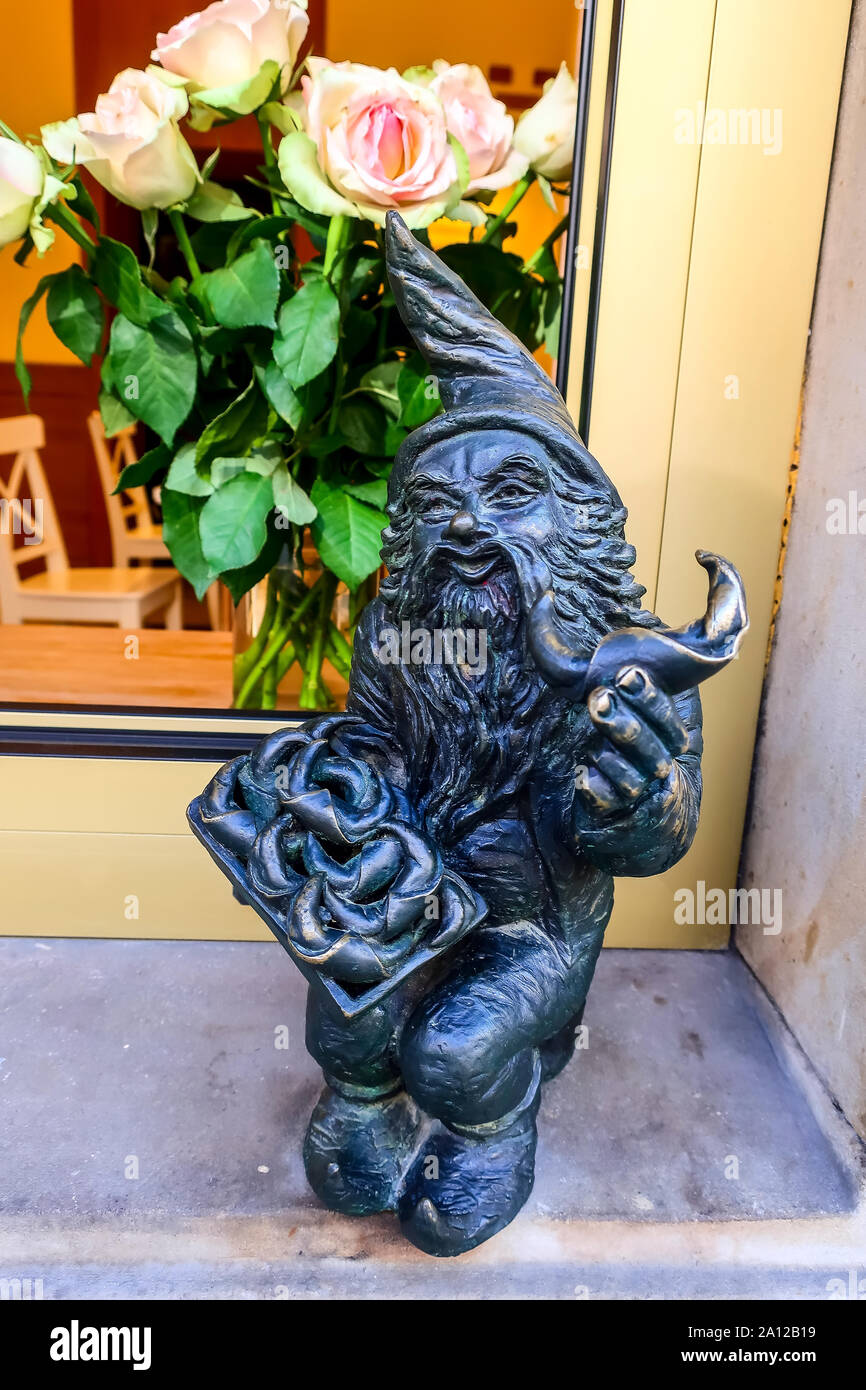 Dwarf gnome with flowers sculpture, symbol of Wroclaw, Poland Stock ...